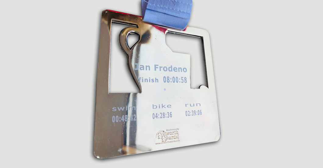 Jan Frodeno's Ironman Medal, his Shirt & Book