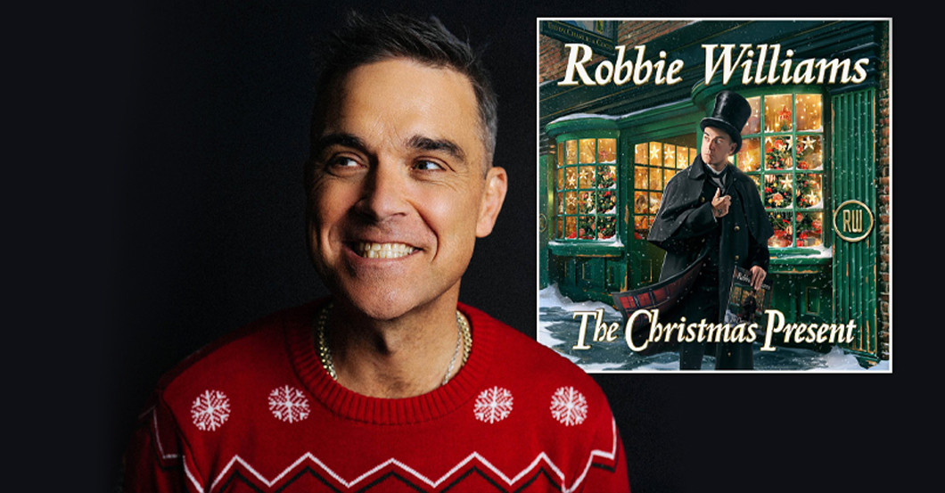 Unique! Robbie Williams signs his Christmas CD