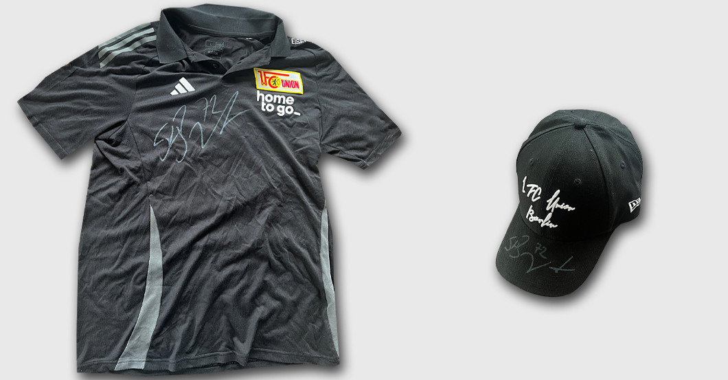 Union Berlin Trainer Baumgart stiftet signiertes Shirt und Cap